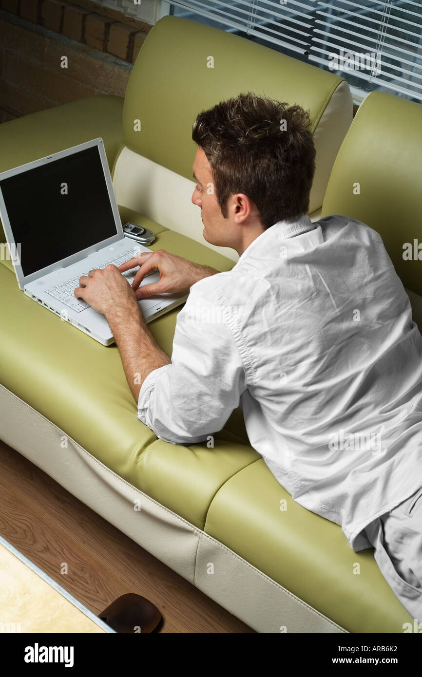 Man lying on stomach using hi-res stock photography and images - Alamy