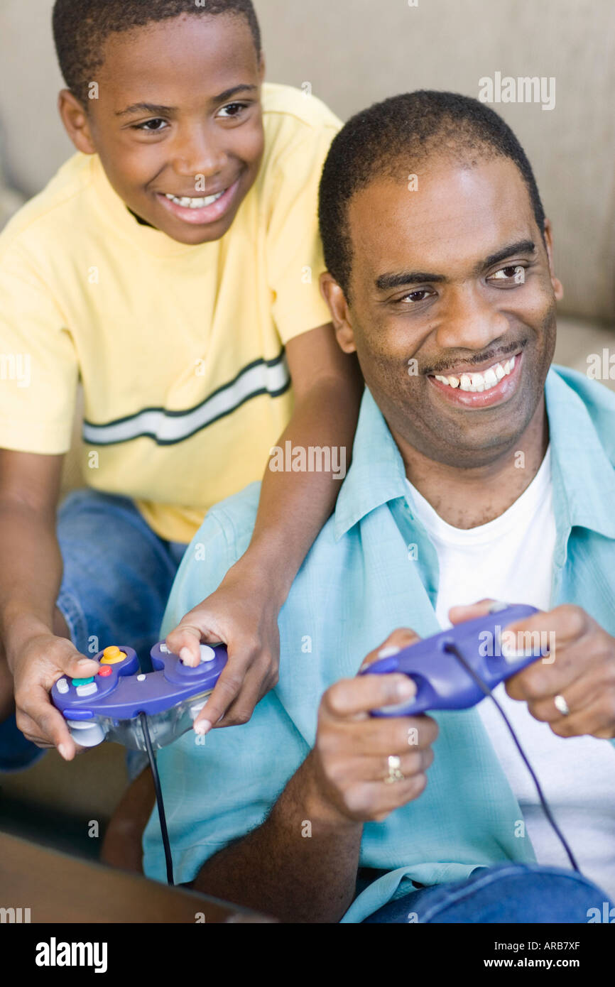 Father and Son Playing Video Game Stock Photo - Alamy