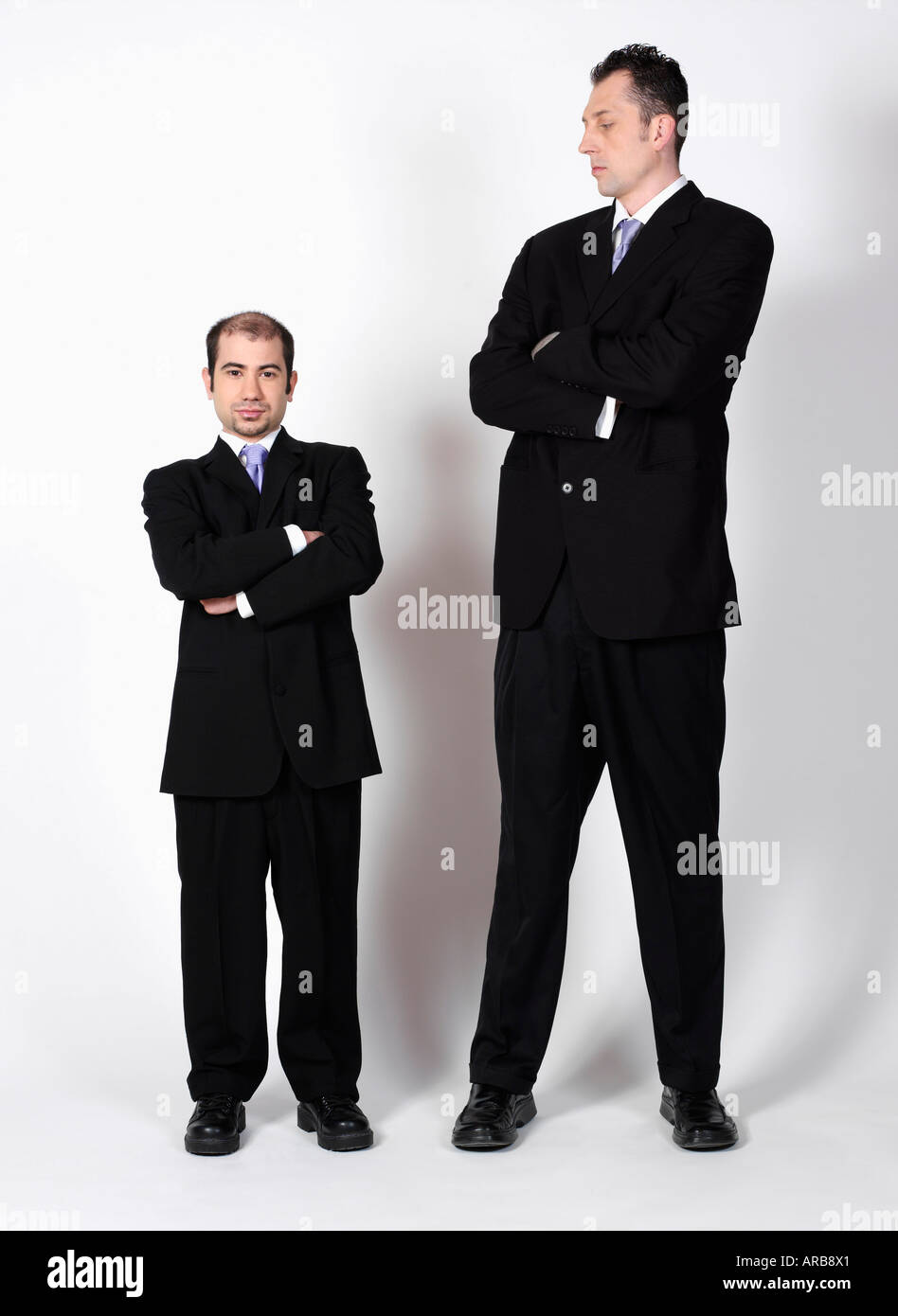 Person looking down tall and small hi-res stock photography and images ...
