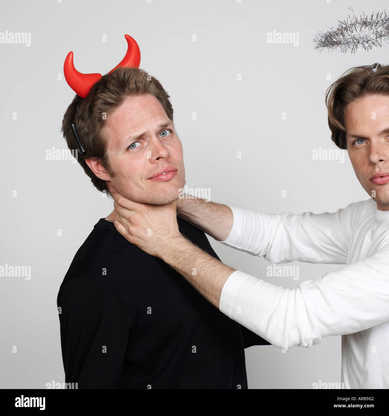 Portrait identical adult male twins hi-res stock photography and images ...