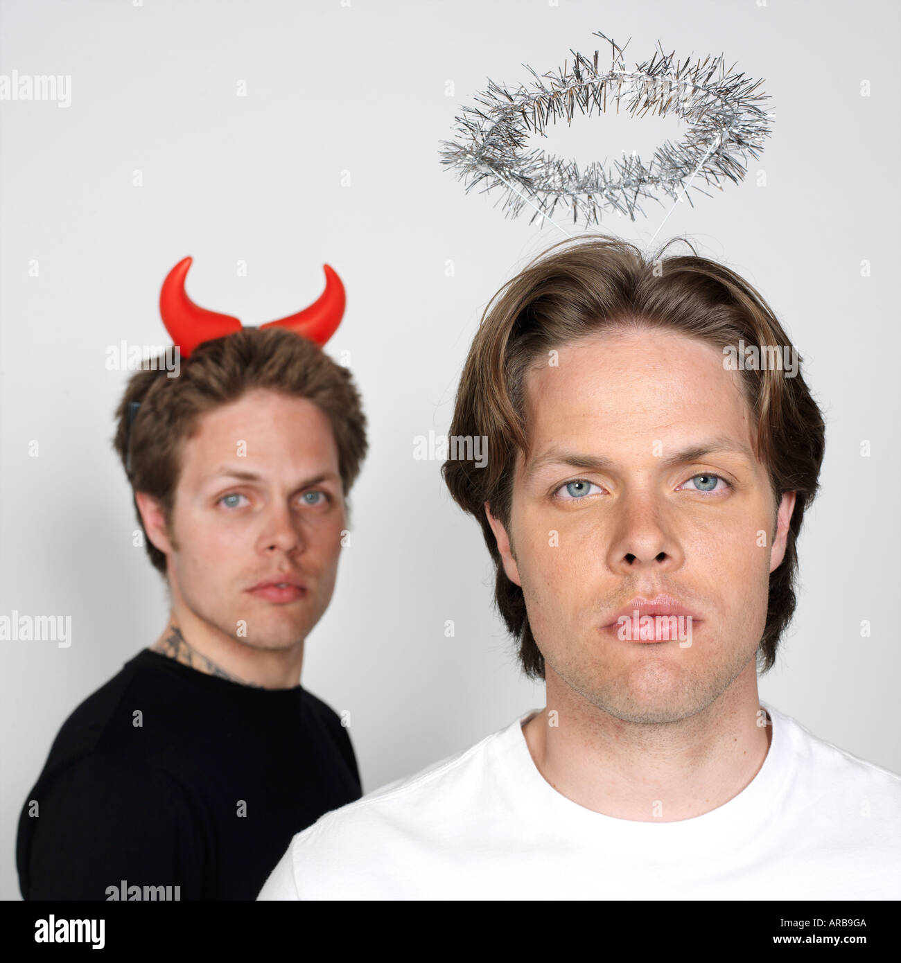 Portrait identical adult male twins hi-res stock photography and images ...