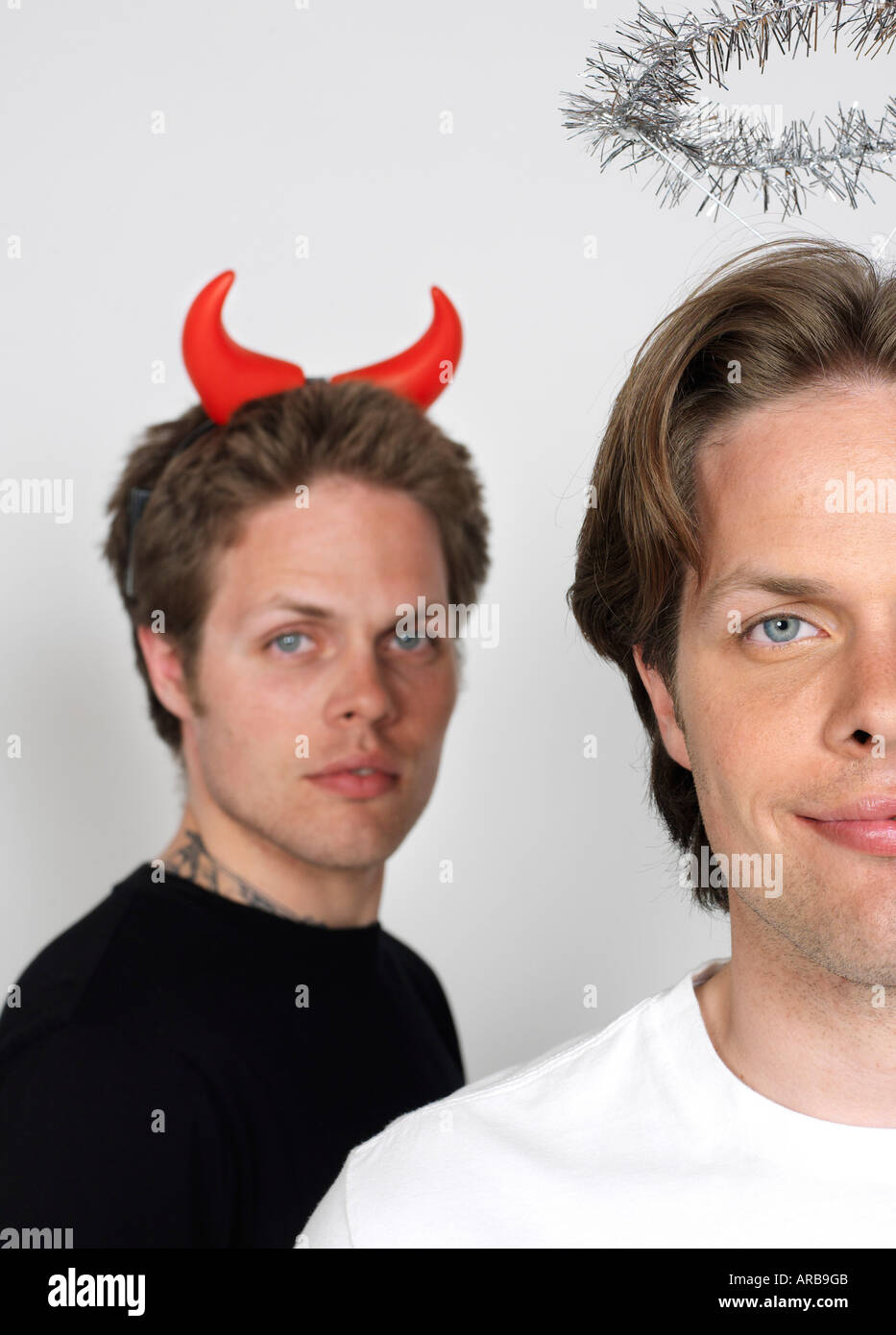 Portrait identical adult male twins hi-res stock photography and images ...
