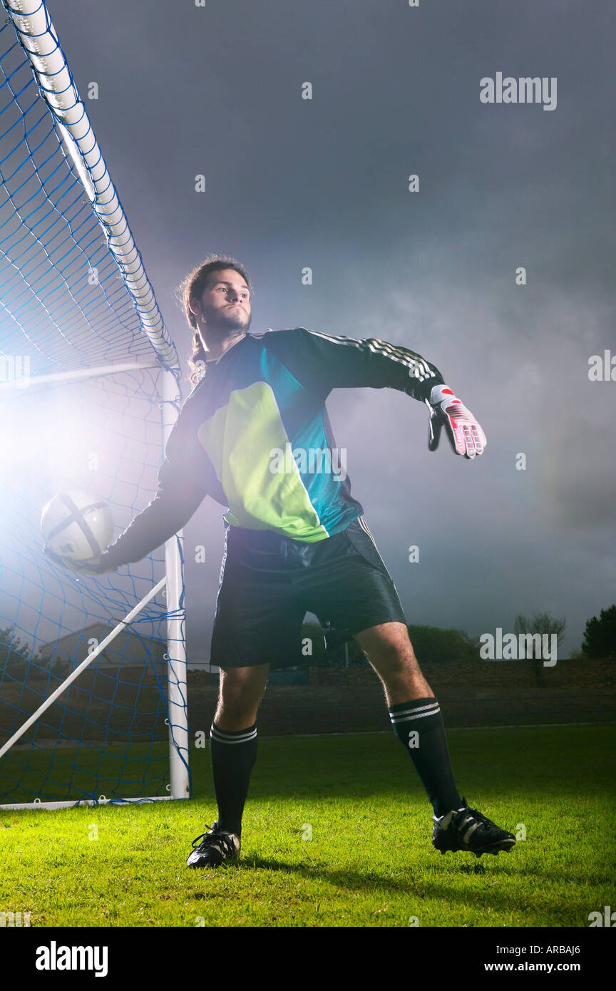 Goalkeeper man throwing ball hi-res stock photography and images - Alamy