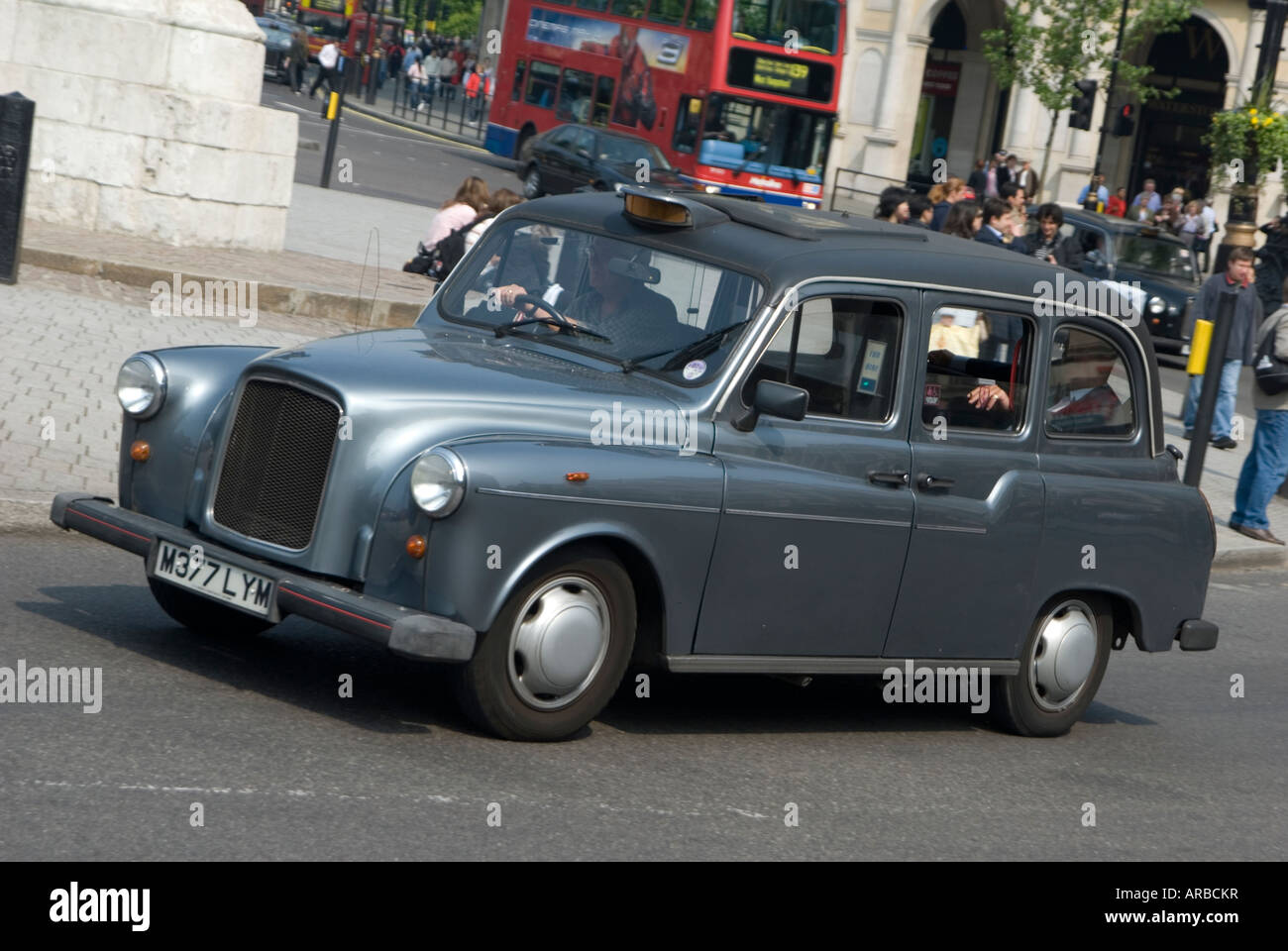 London Taxi cab driving through London England Stock Photo - Alamy