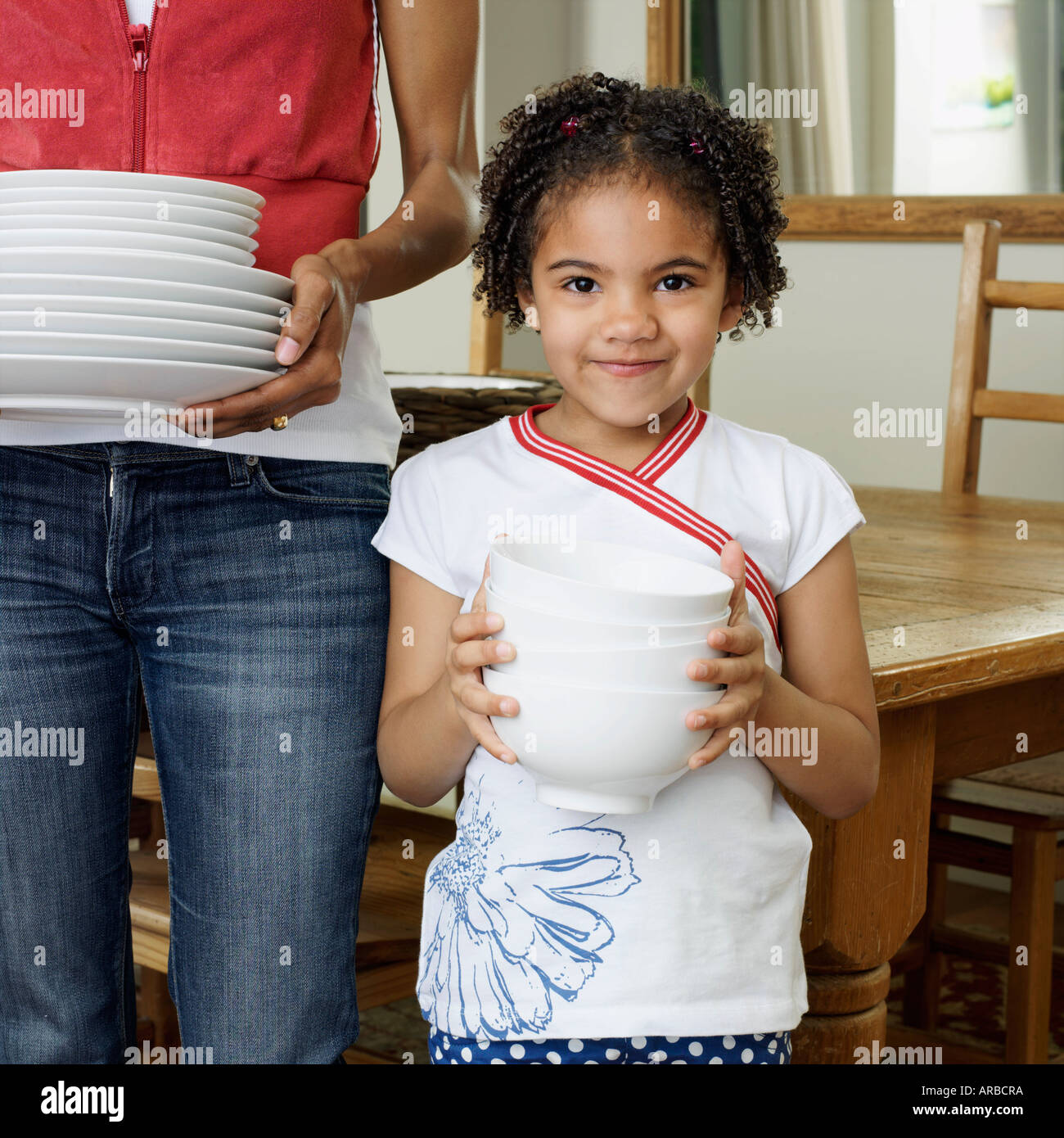 Old woman carrying dish to table hi-res stock photography and images ...