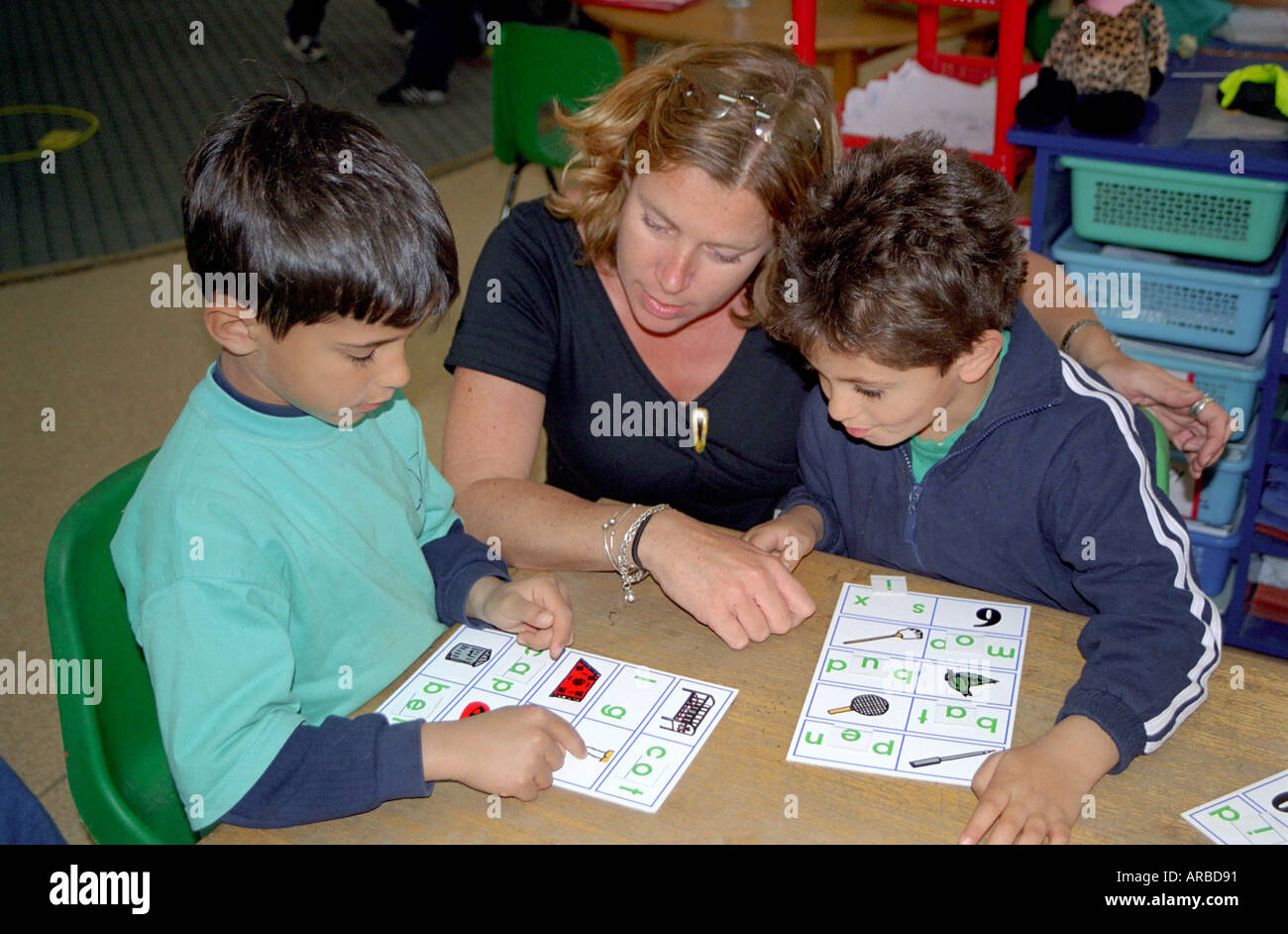 school children in class room with teacher Stock Photo - Alamy