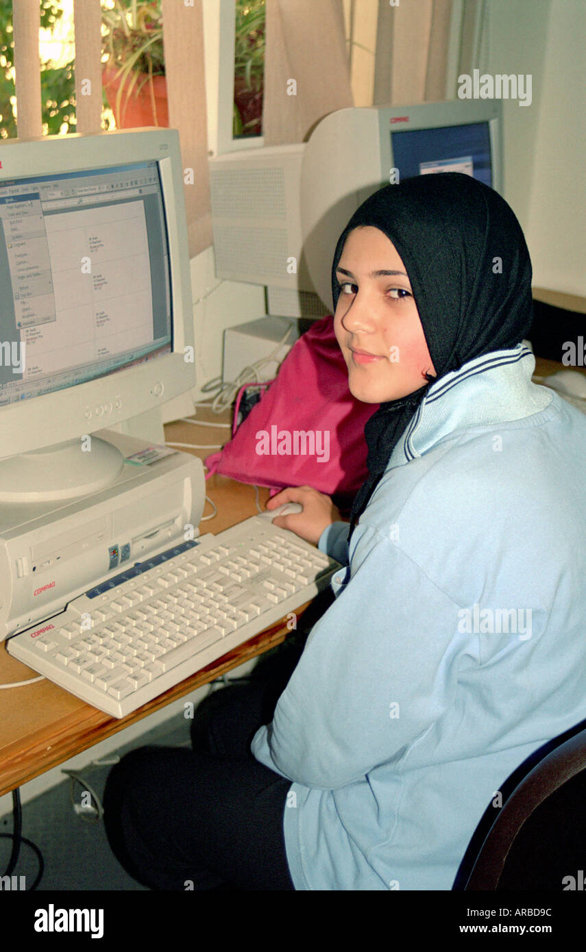 Muslim school girl working on computer Stock Photo - Alamy