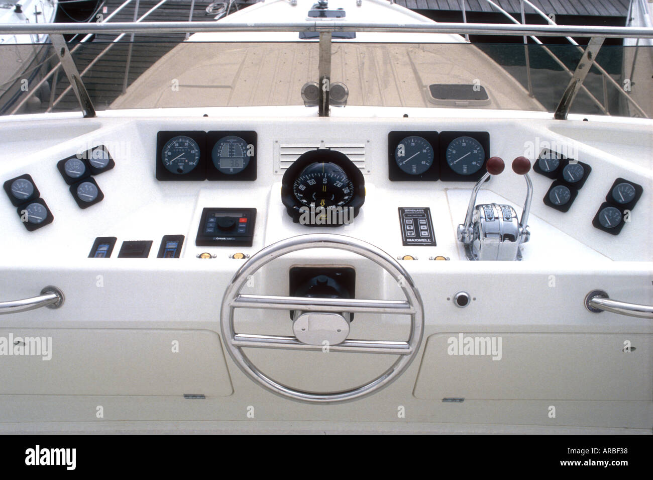 The upper helm position on the flying bridge of a moder motor cruiser ...