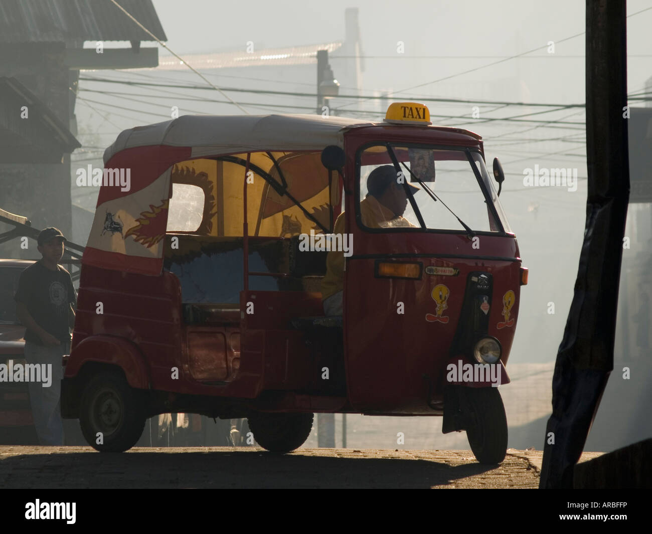 Three wheeled taxis made in India Stock Photo - Alamy