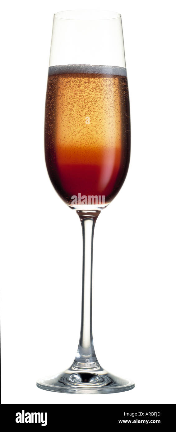 Sloe Royale cocktail in a flute on a white background Stock Photo - Alamy