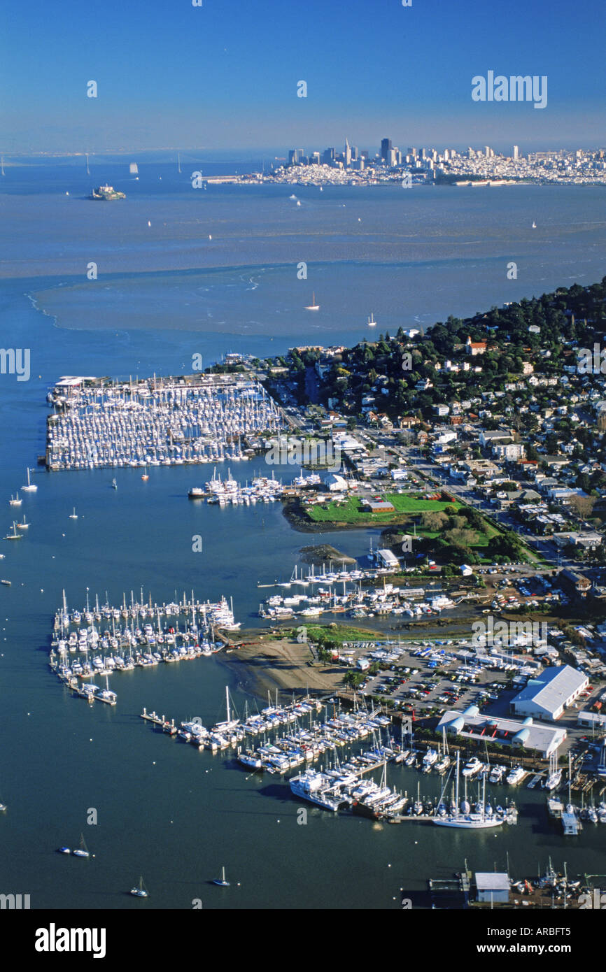 Aerial view of Sausalito harbor filled with yachts and San Francisco ...