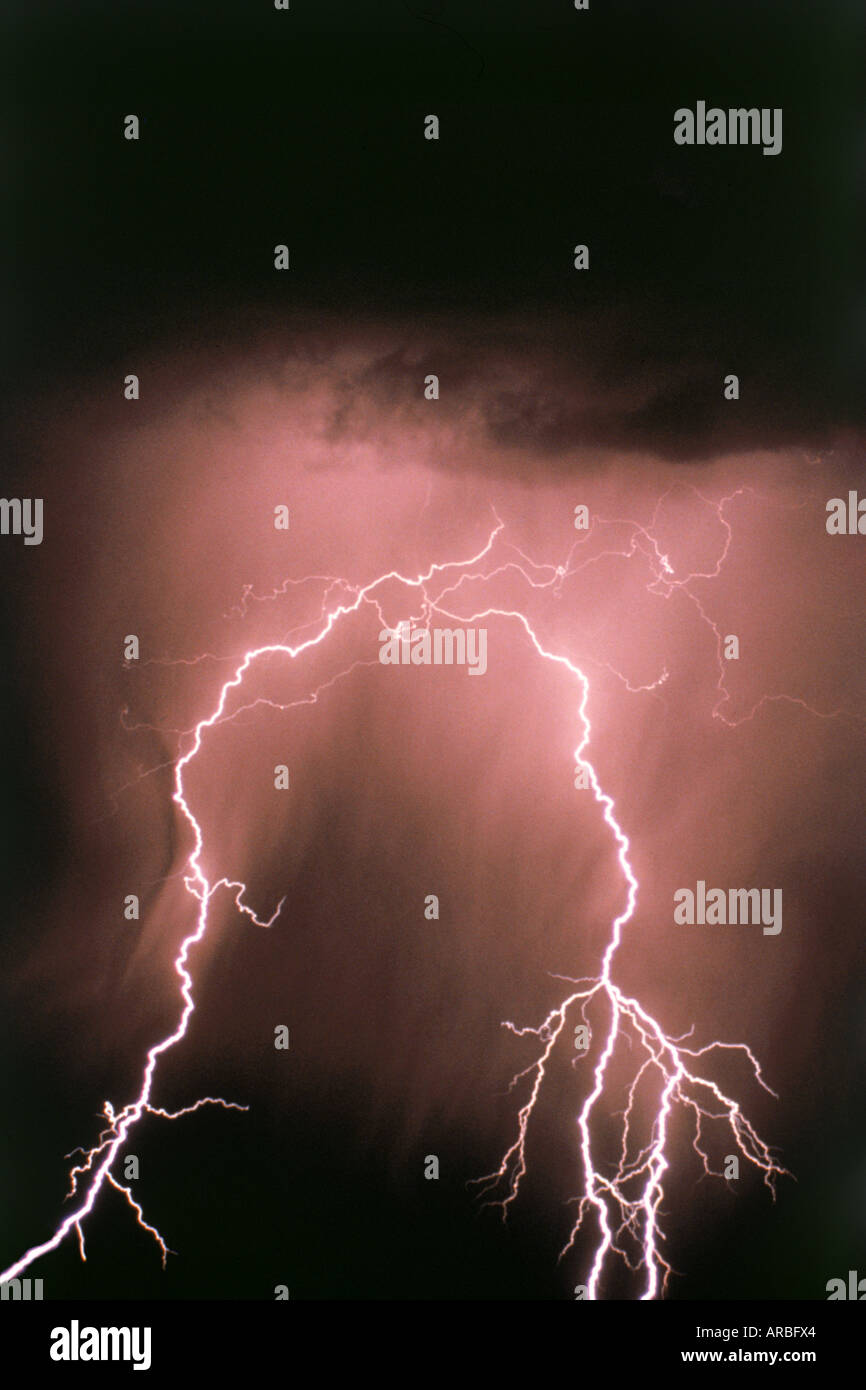 Lightning bolt slicing night sky Stock Photo - Alamy