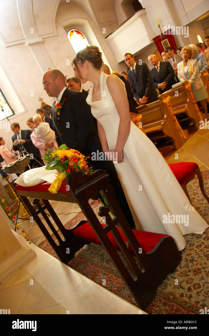 bridal couple at the altar Stock Photo - Alamy