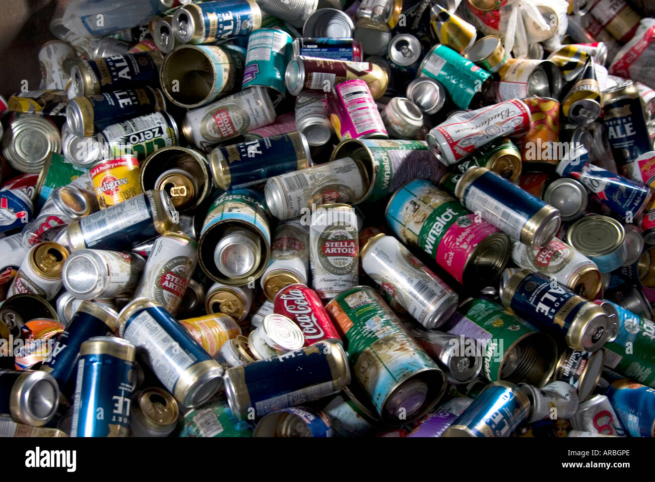 Aluminium cans deposited into recycling container awaiting collection ...