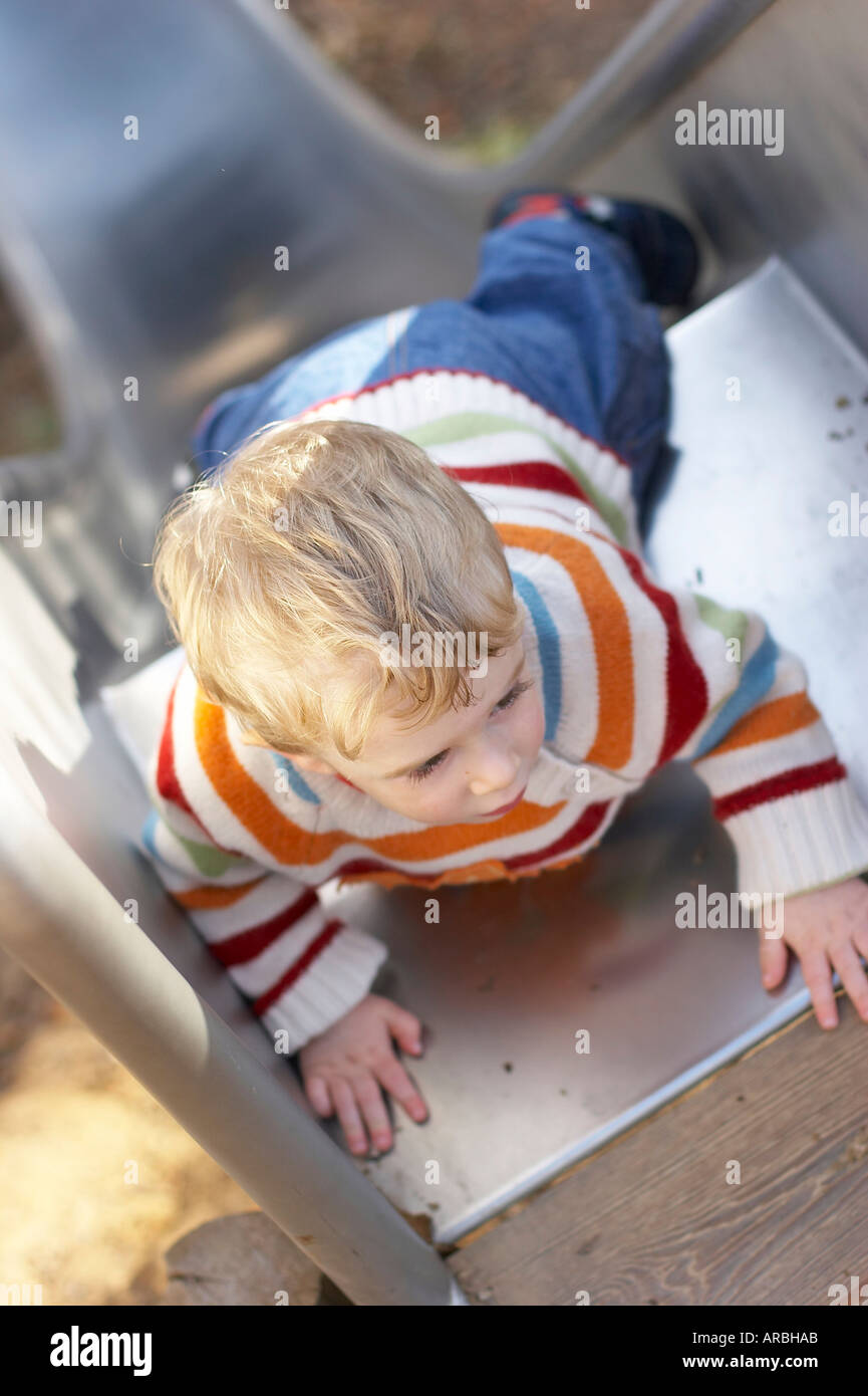 baby sliding down the slide on the playground Stock Photo - Alamy