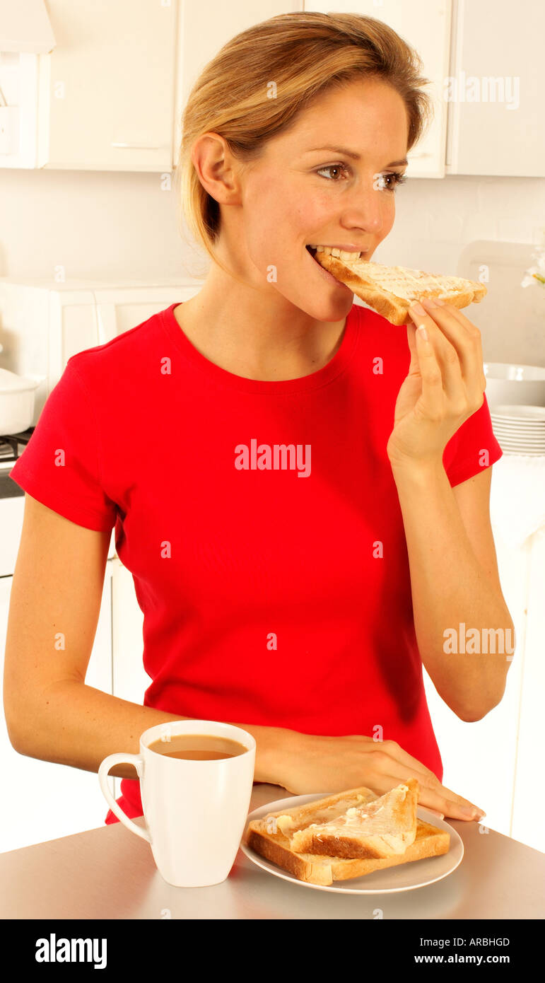 GIRL EATING TOAST Stock Photo - Alamy