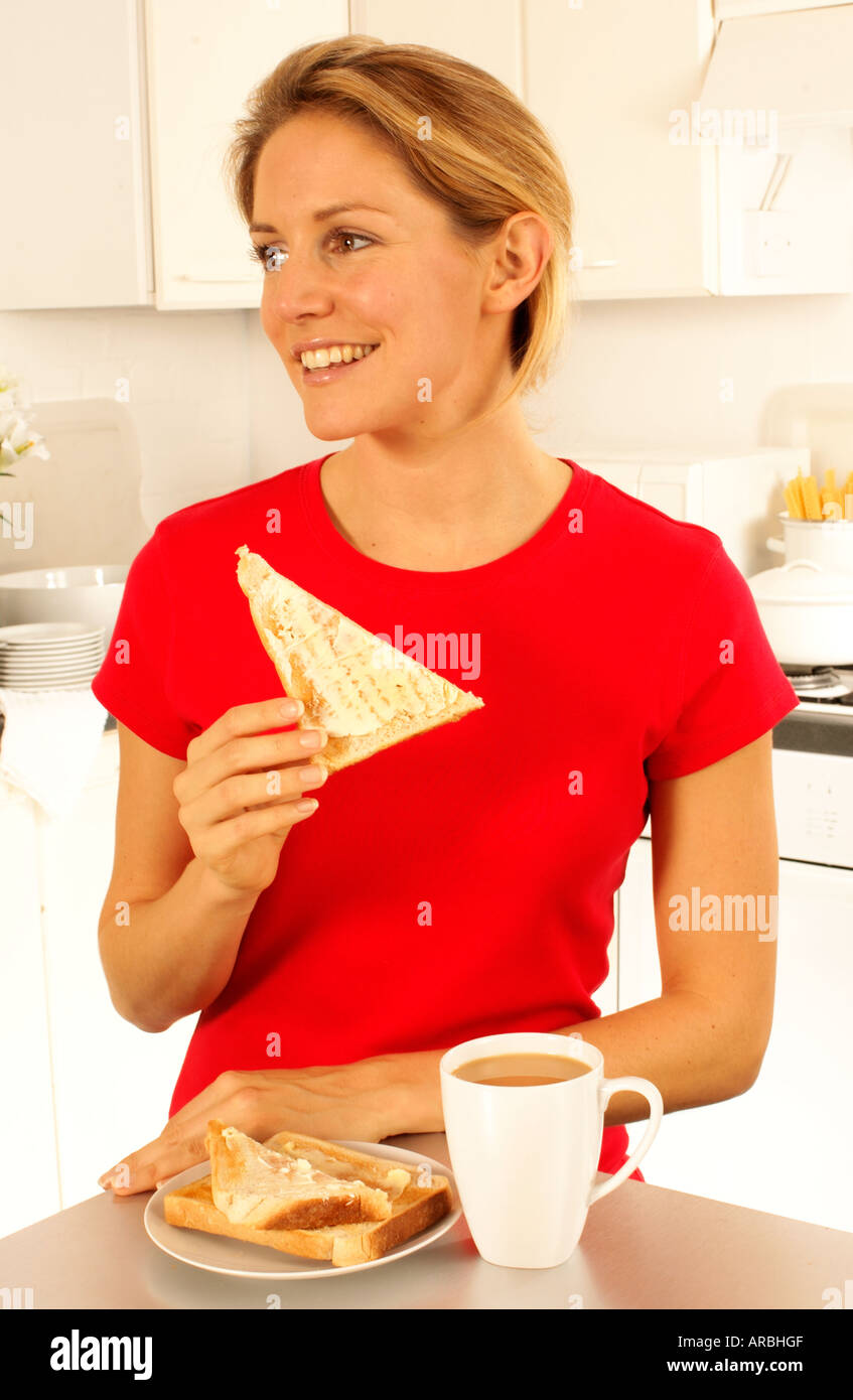 GIRL EATING TOAST Stock Photo - Alamy