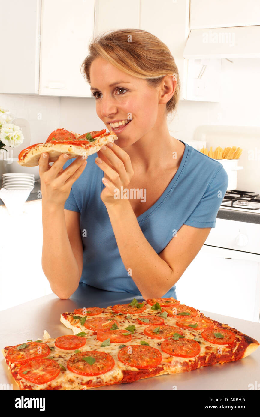 GIRL EATING PIZZA Stock Photo - Alamy