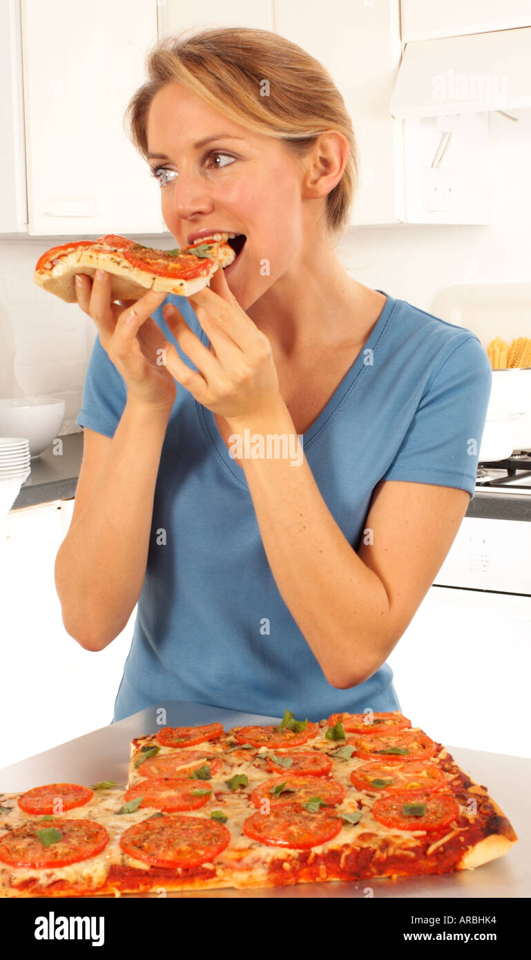 Girl topping pizza hi-res stock photography and images - Alamy