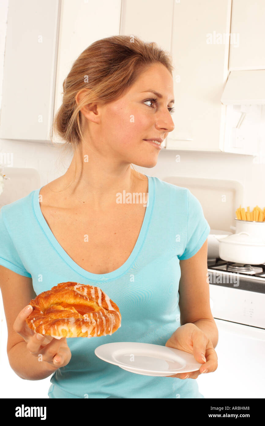 GIRL EATING DANISH PASTRY Stock Photo - Alamy
