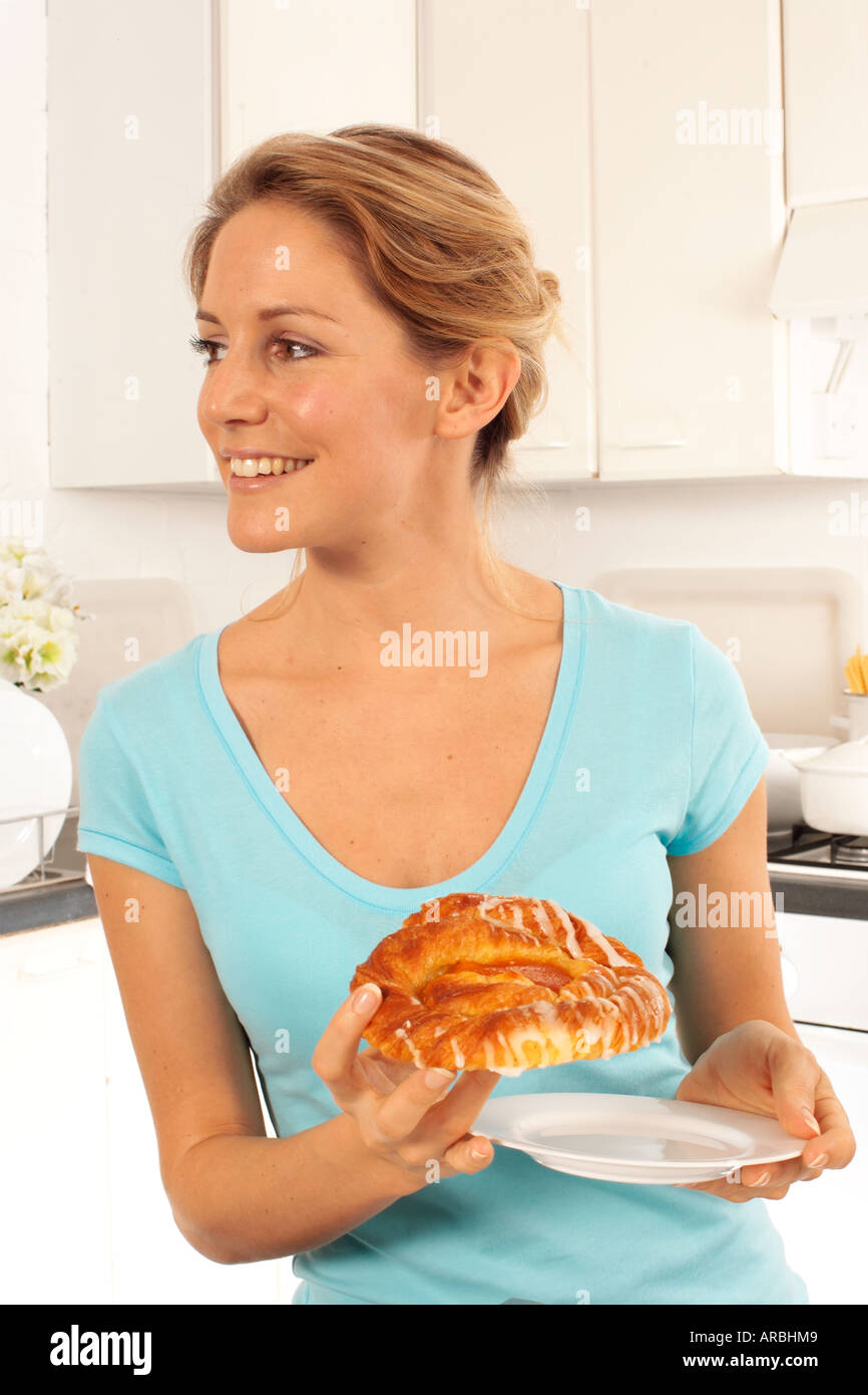 GIRL EATING DANISH PASTRY Stock Photo - Alamy