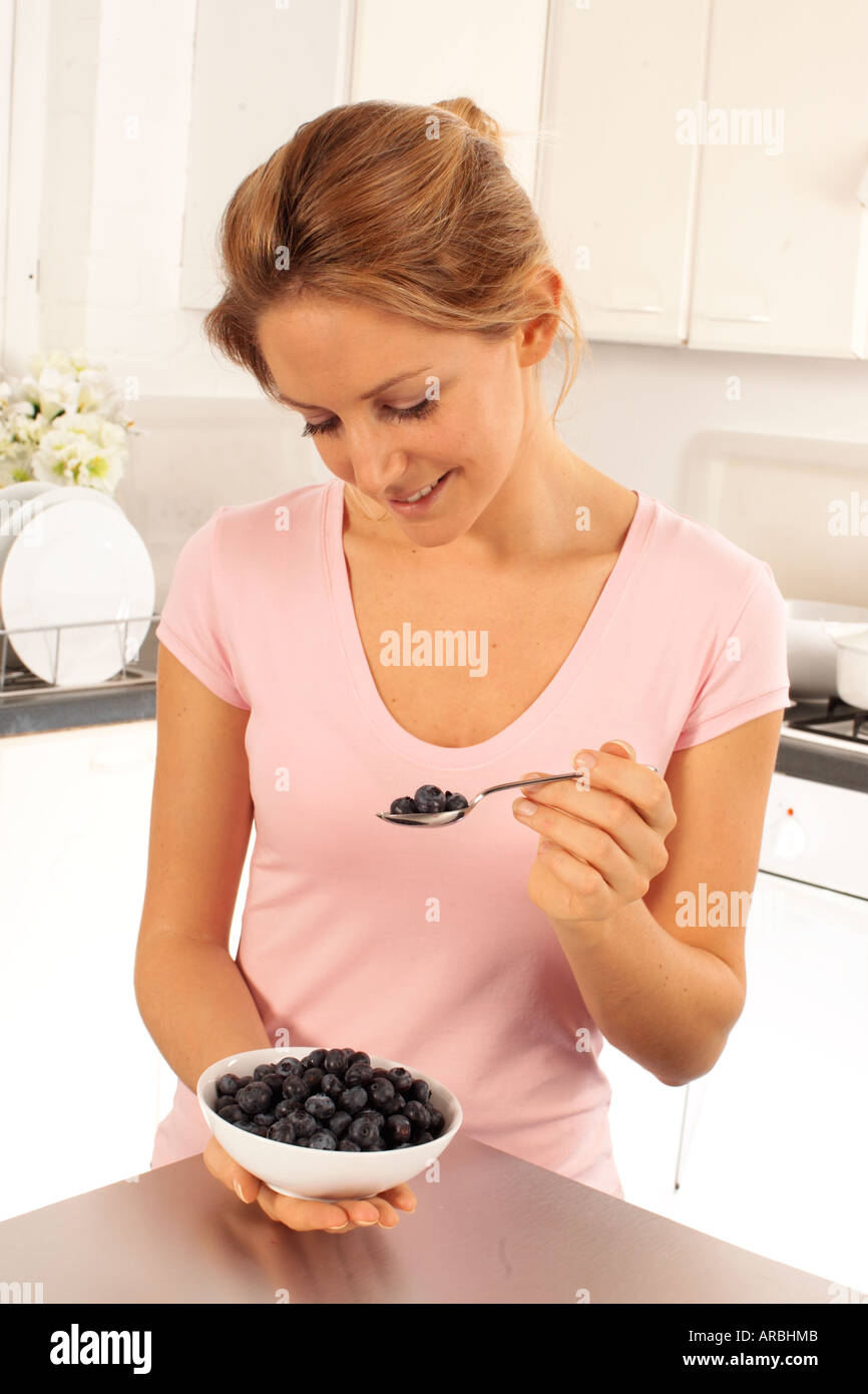GIRL EATING BLUEBERRIES Stock Photo - Alamy