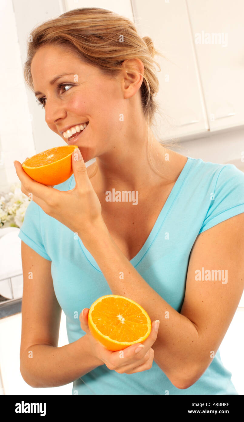 Woman eating an orange hi-res stock photography and images - Alamy