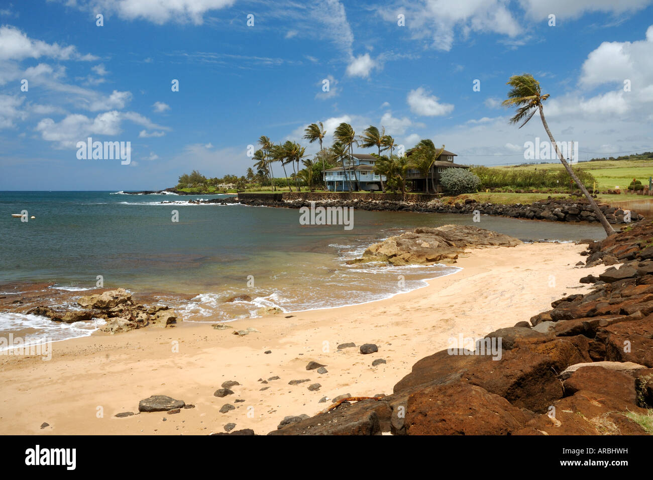Small beaches and beautiful estates line the shore in Kukuiula Kauai ...