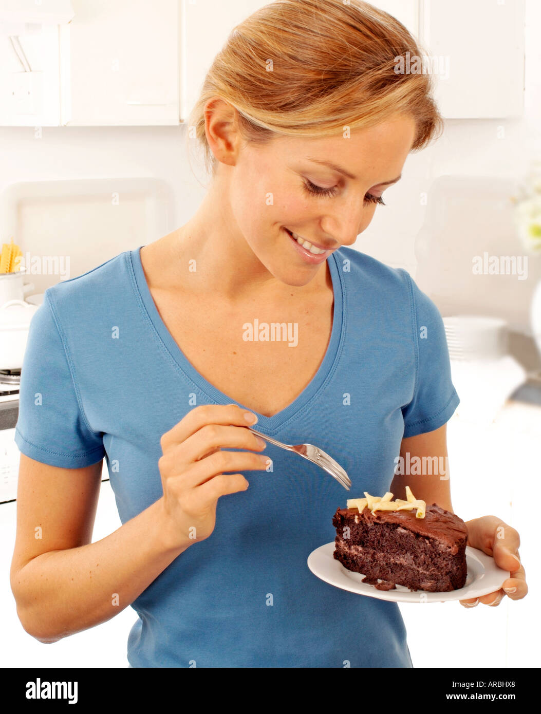 WOMAN EATING CHOCOLATE CAKE Stock Photo - Alamy