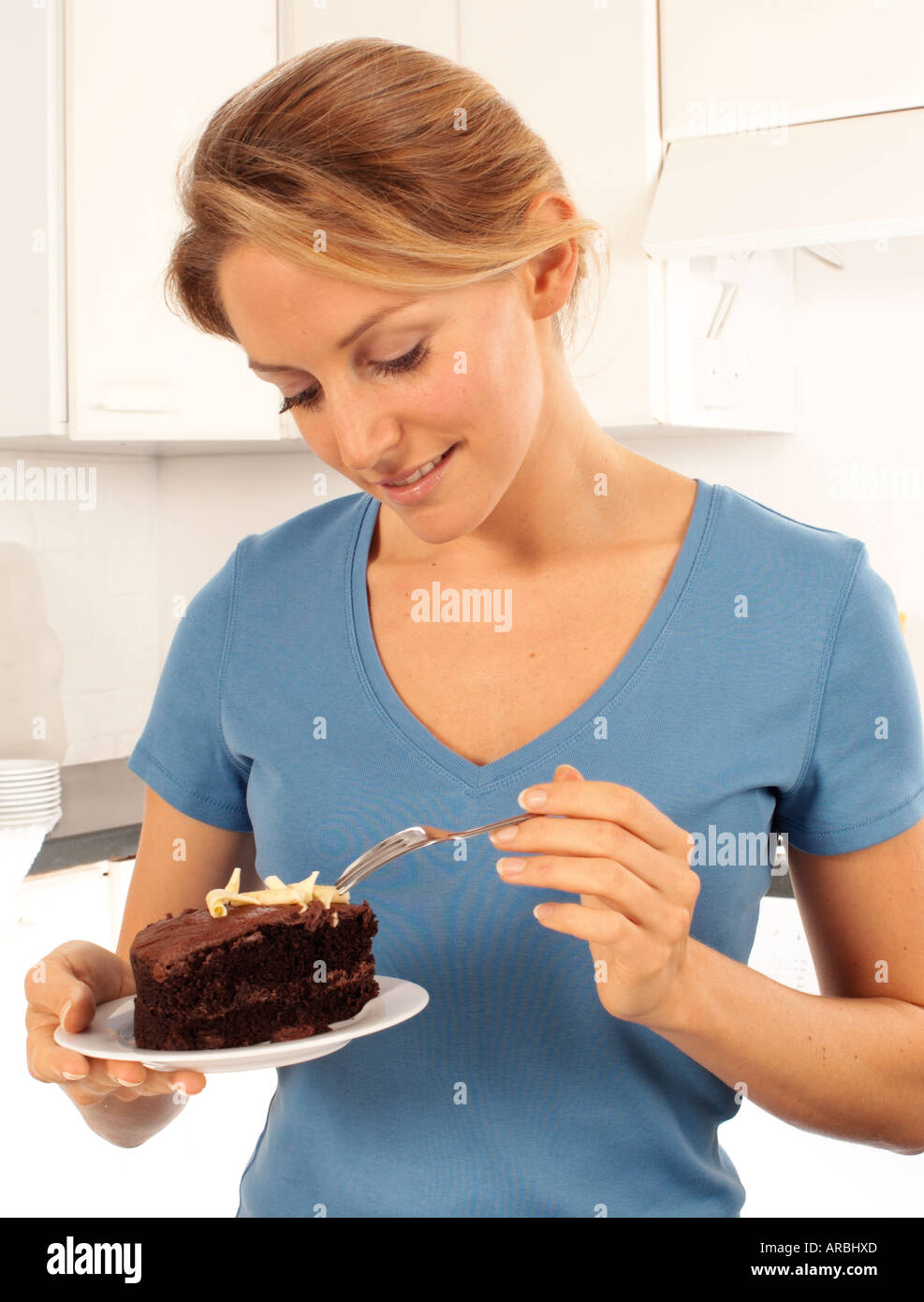 WOMAN EATING CHOCOLATE CAKE Stock Photo - Alamy