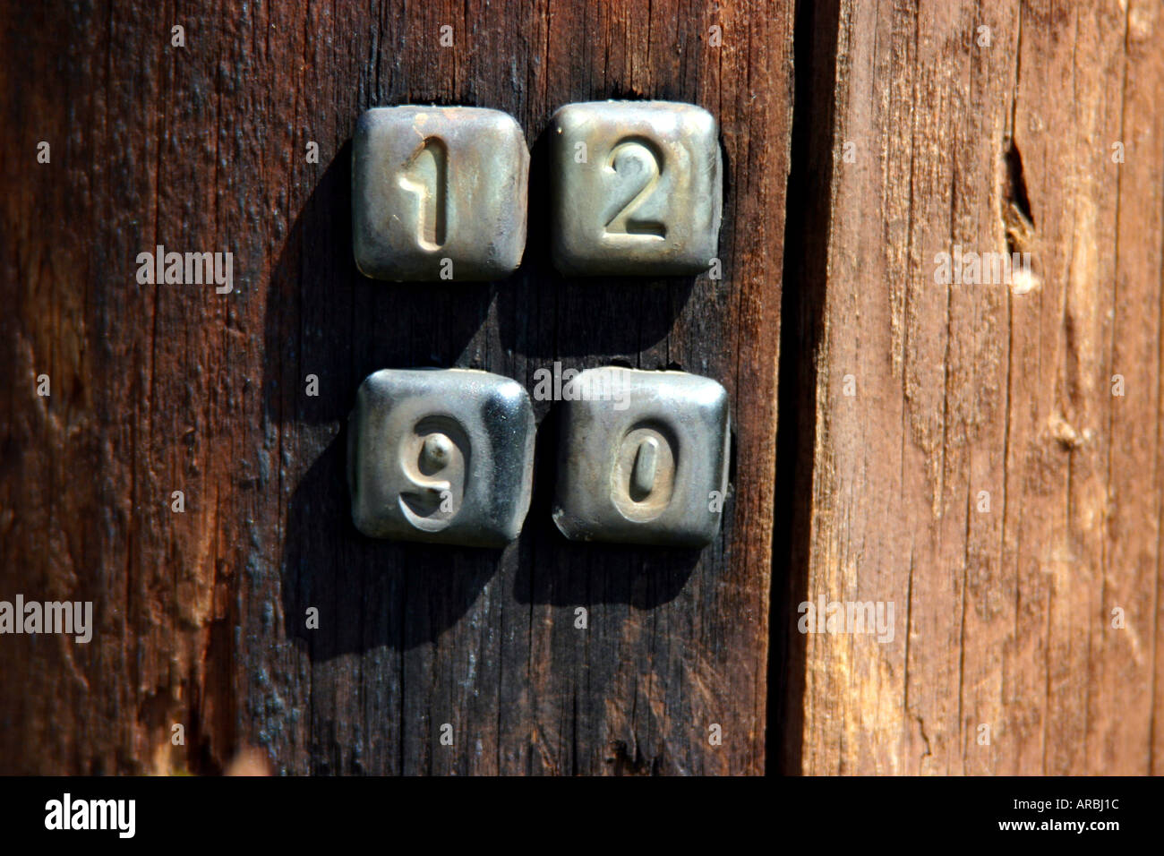 Metal numbers on telephone pole hi-res stock photography and images - Alamy