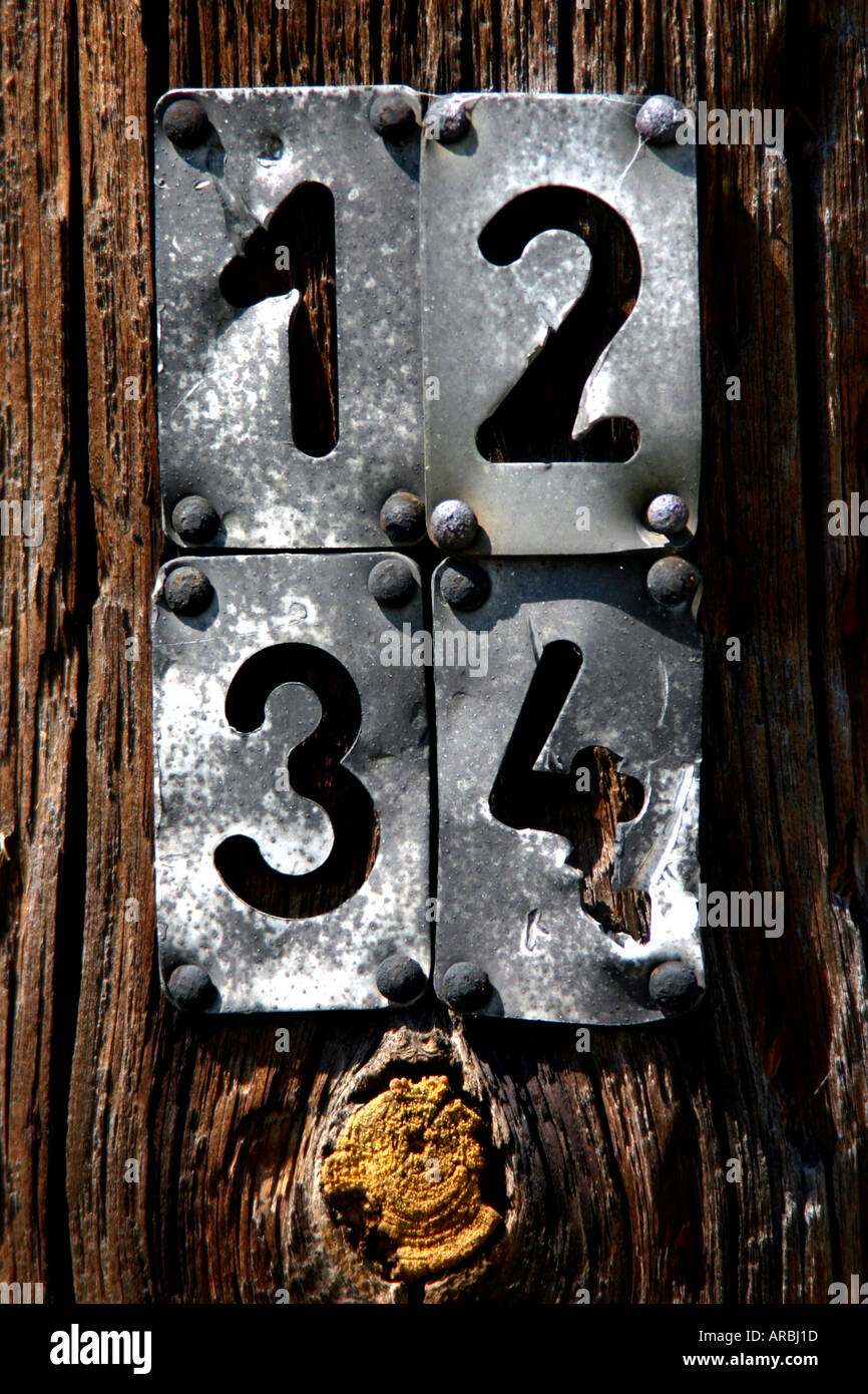 Metal numbers on telephone pole hi-res stock photography and images - Alamy