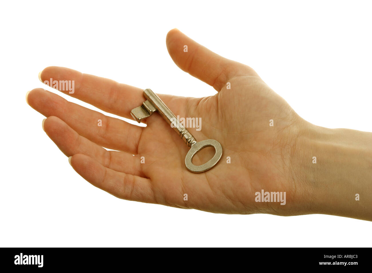 Hand holding key Stock Photo - Alamy