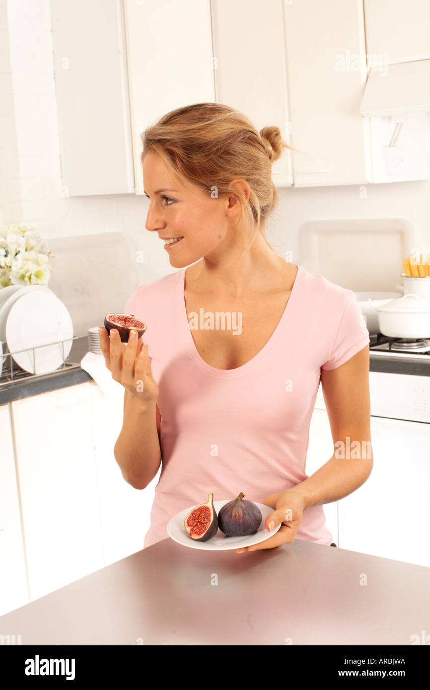 GIRL EATING FIGS Stock Photo - Alamy