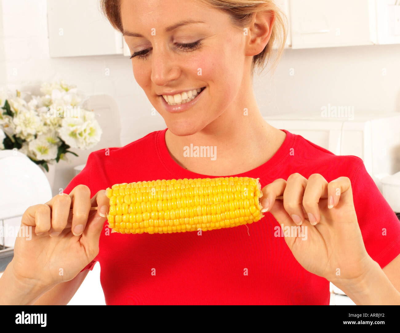 GIRL EATING SWEETCORN Stock Photo - Alamy