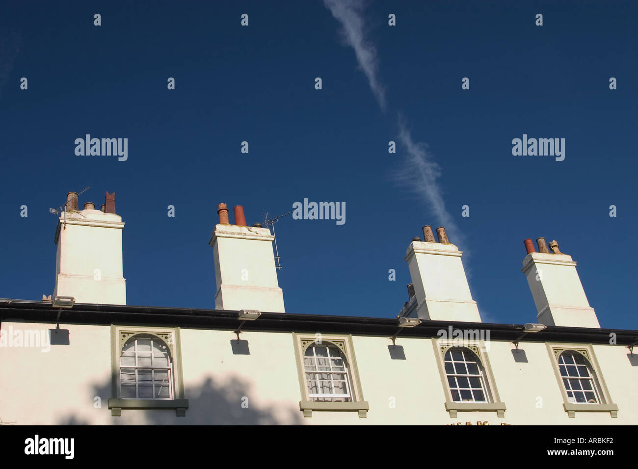 Four chimneys and four windows Stock Photo - Alamy