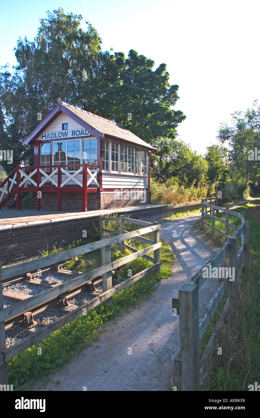 Disused railway line and signal box at Hadlow Road railway station ...