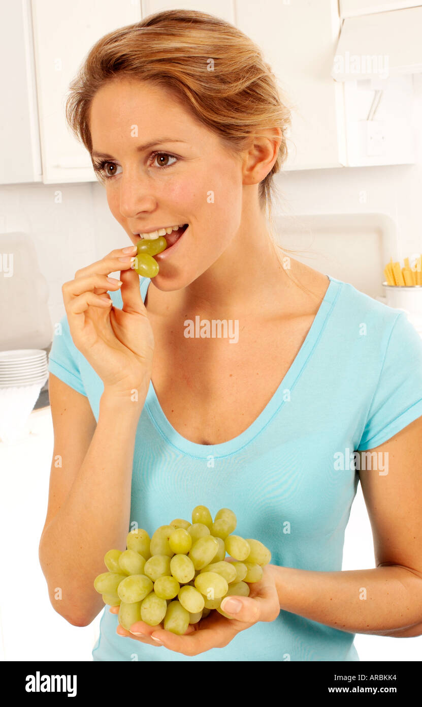 GIRL EATING GRAPES Stock Photo - Alamy