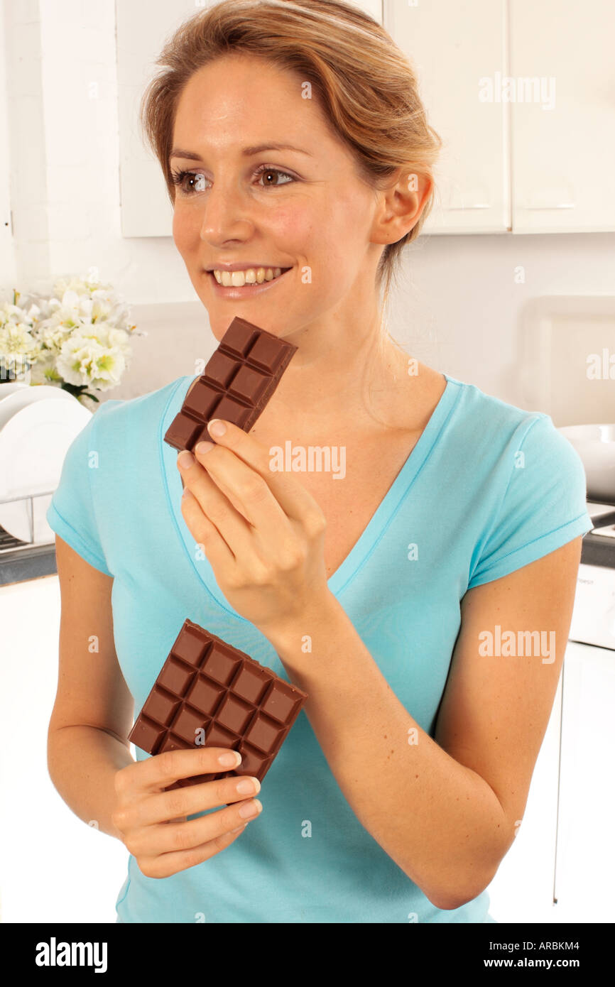 Woman binge eating kitchen hi-res stock photography and images - Alamy