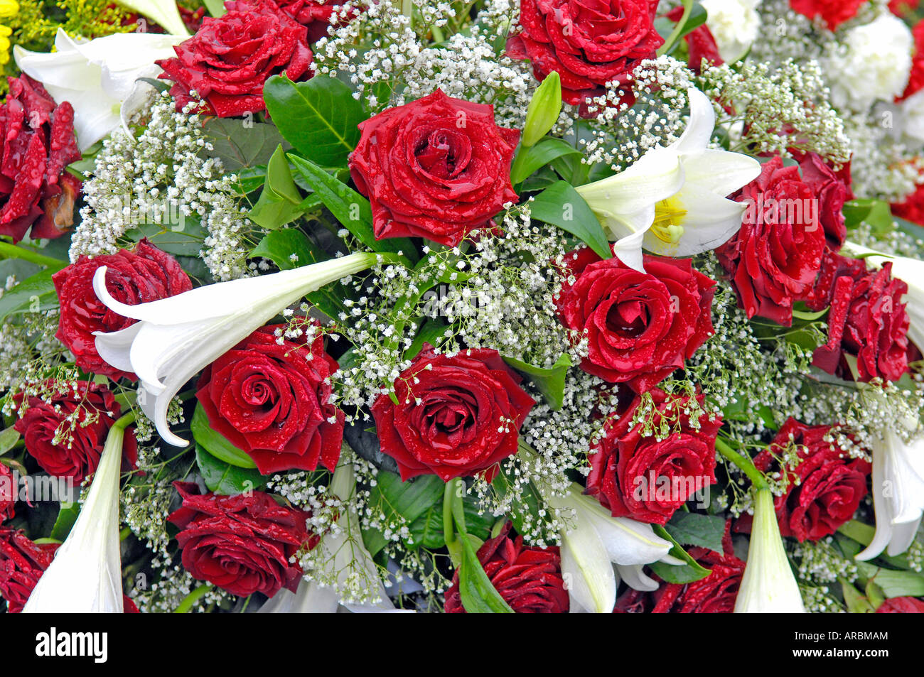 water filled waterlogged red roses flower tribute memorial funeral ...