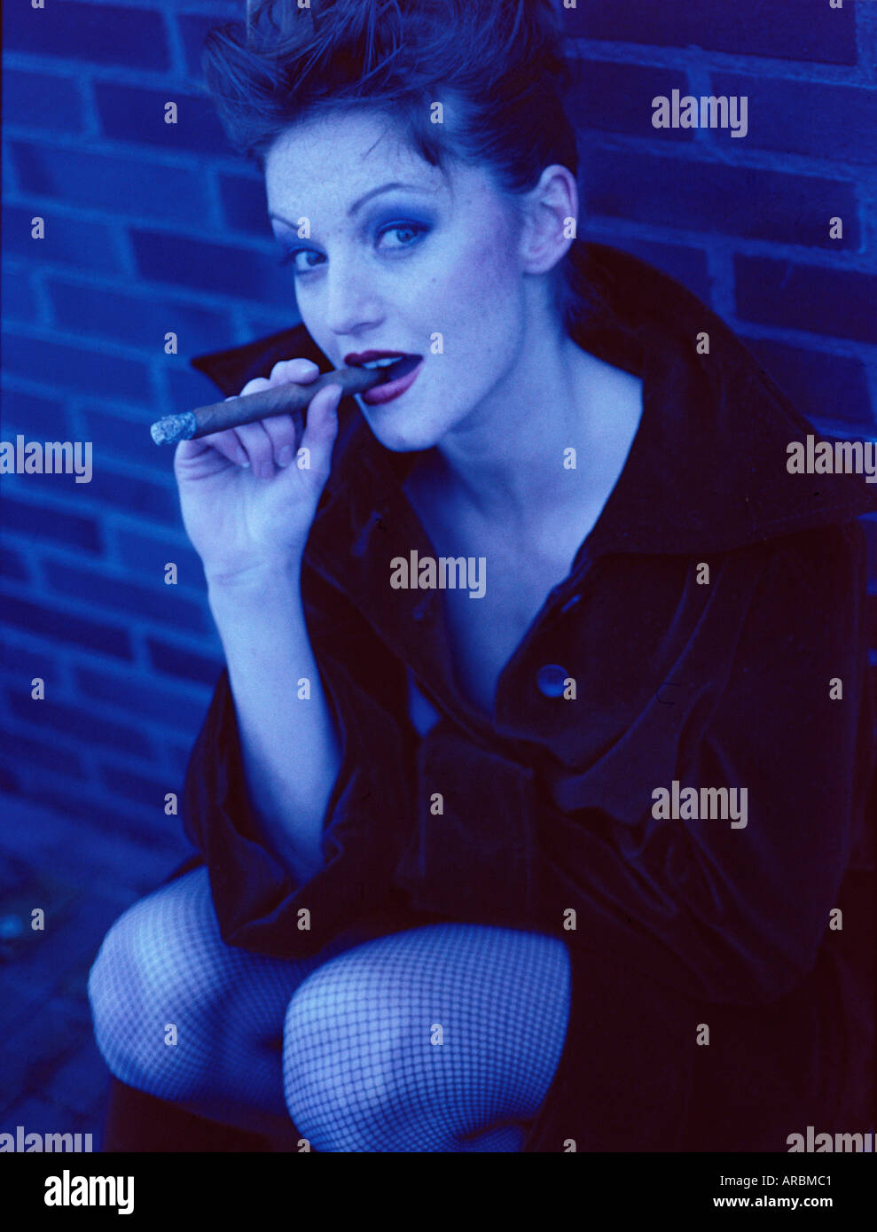 Portrait of female smoking sigar Stock Photo - Alamy