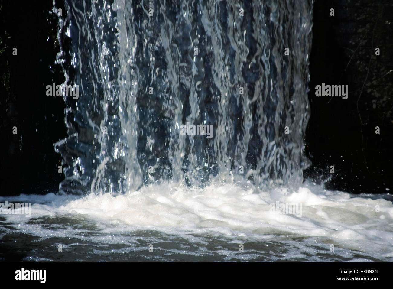 A fall of water from a reservoir to a canal Stock Photo - Alamy