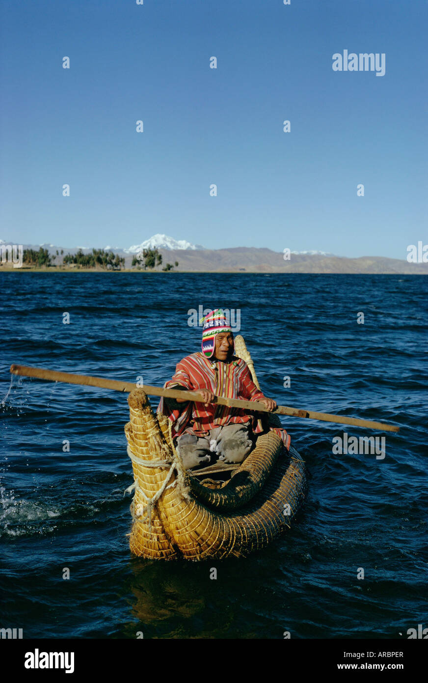 Aymara Indian in a reed boat, Lake Titicaca, Bolivia, South America ...