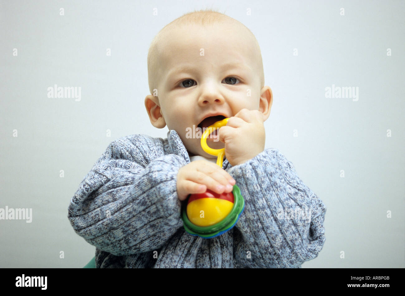 Baby chewing rattle hi-res stock photography and images - Alamy