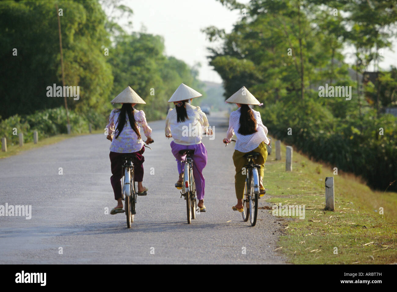 Vietnam girls bicycling to hi-res stock photography and images - Alamy