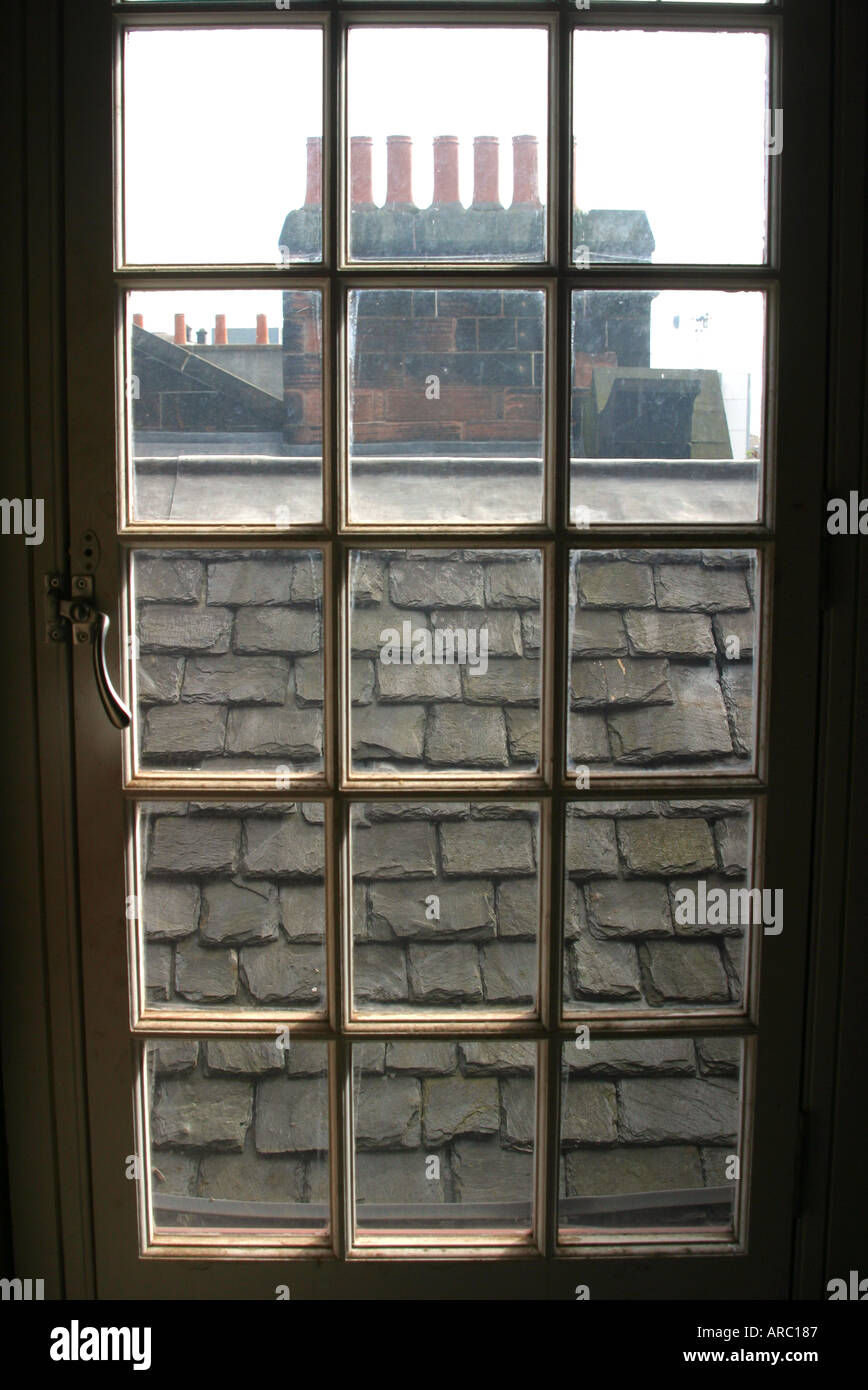 Rooftop viewed through window Stock Photo - Alamy