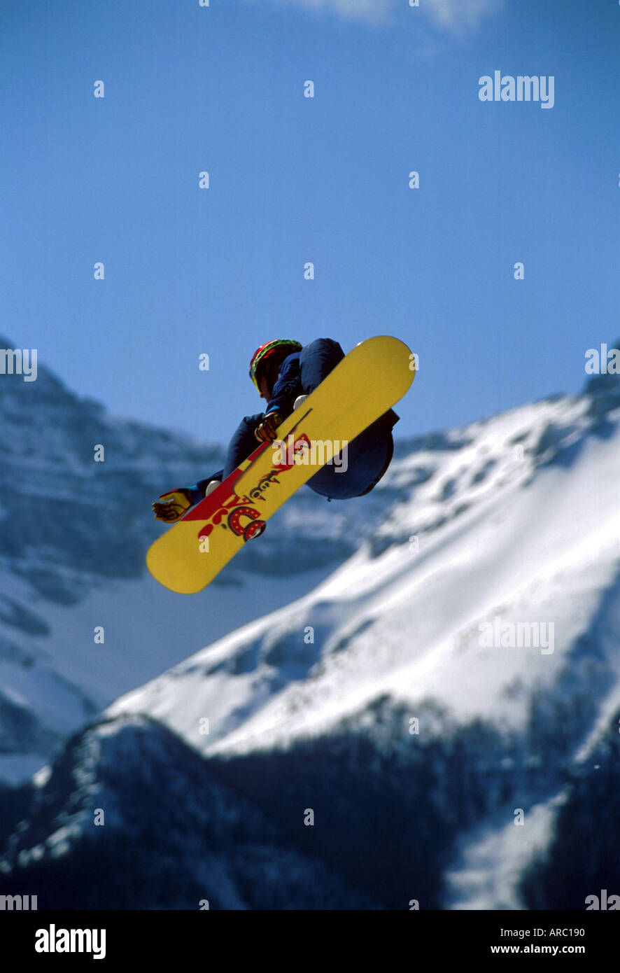 Snowboarder performing grab at big air competition in Canada Stock ...