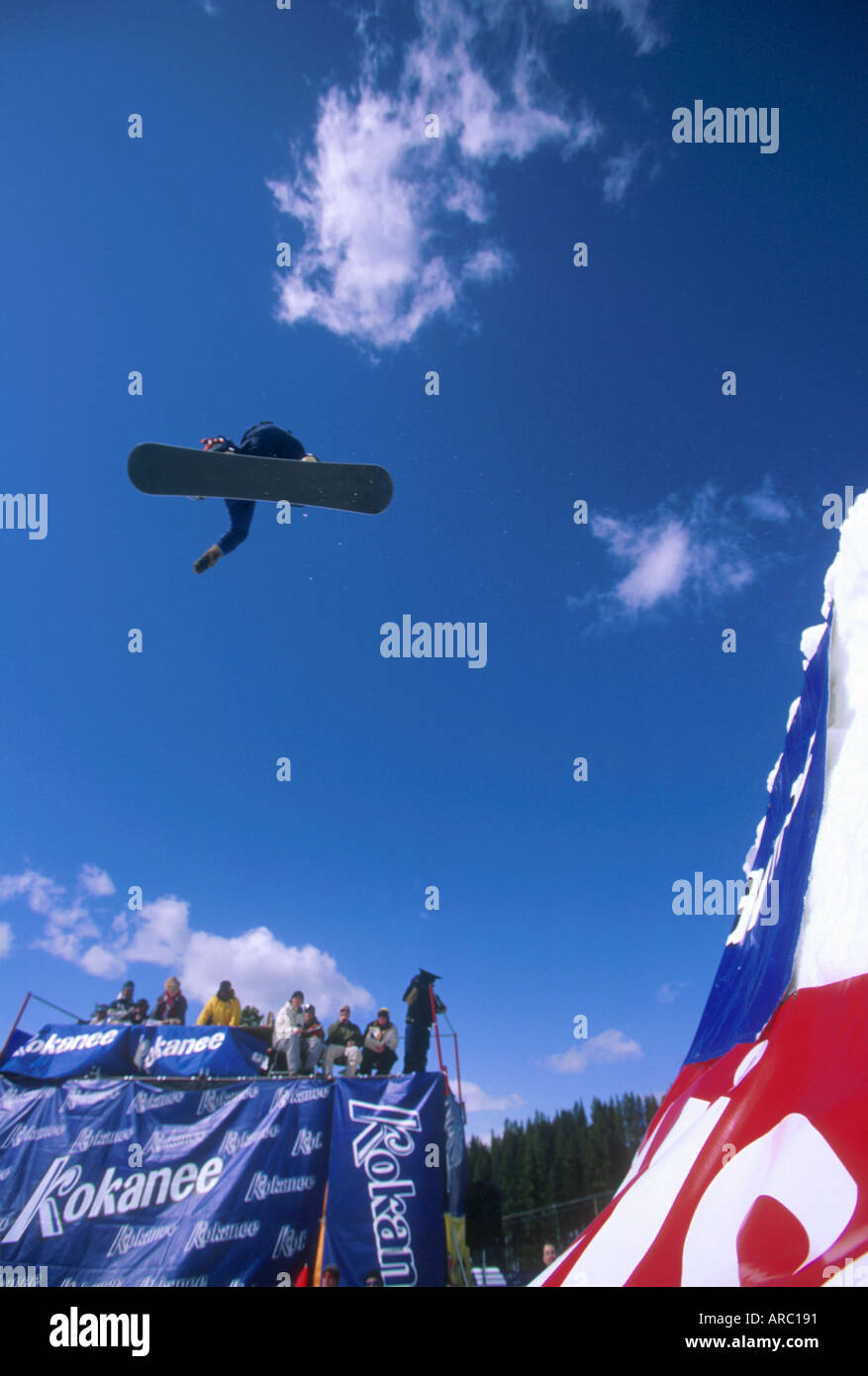 Snowboarder performing grab at big air competition in Canada Stock ...