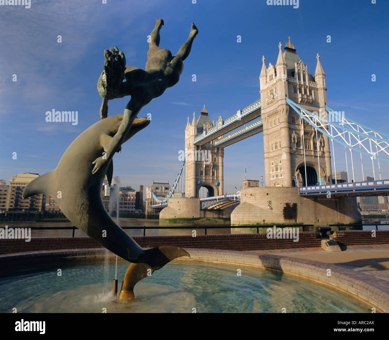 Dolphin sculpture and Tower Bridge, London, England, UK Stock Photo - Alamy