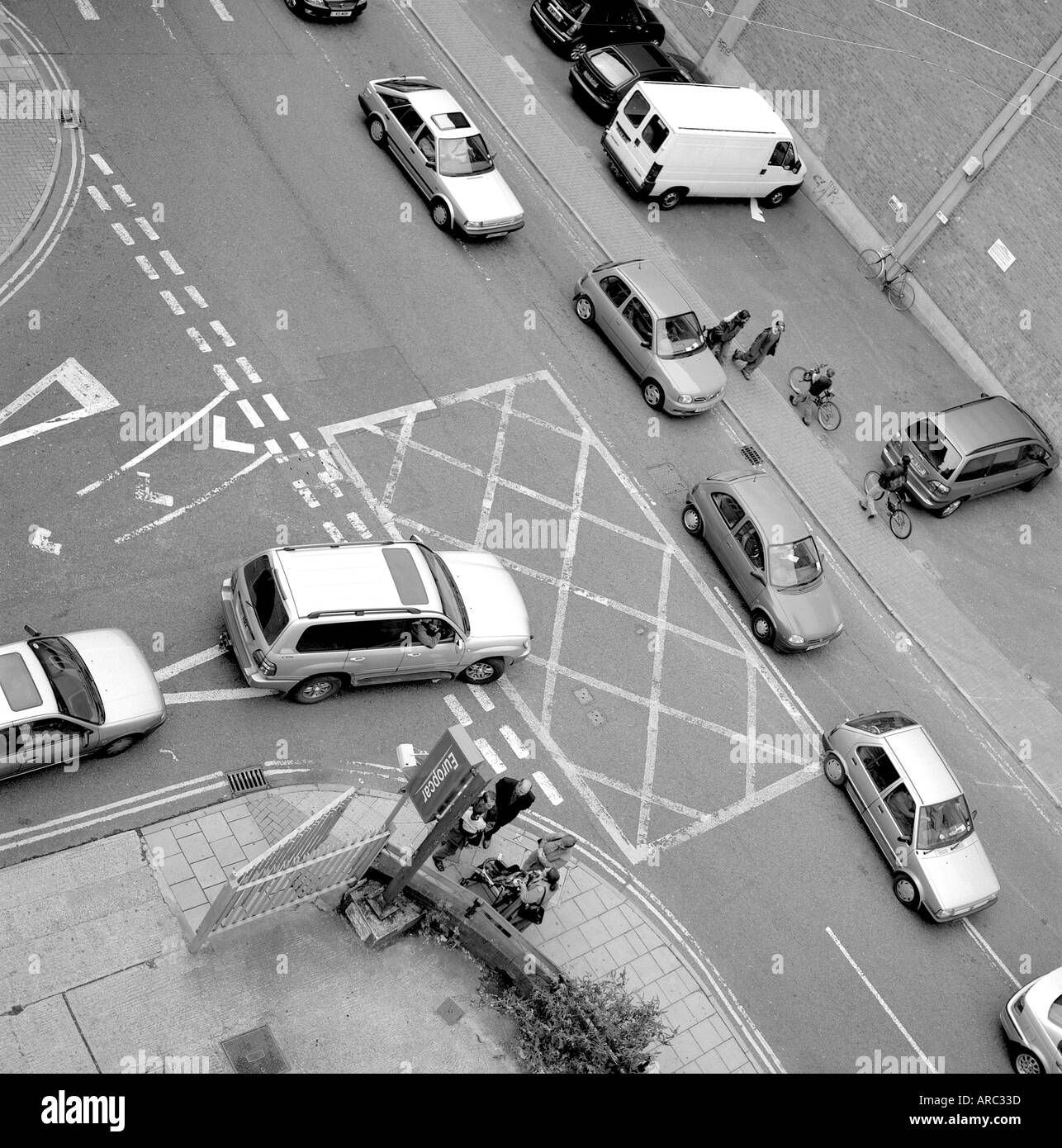 Aerial view of street intersection with cars cyclists and pedestrians ...